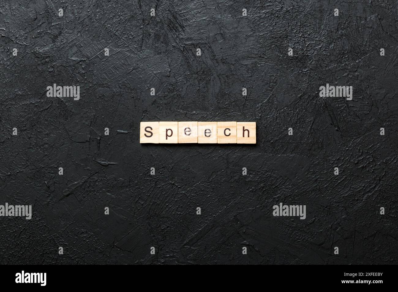 speech word written on wood block. speech text on cement table for your ...