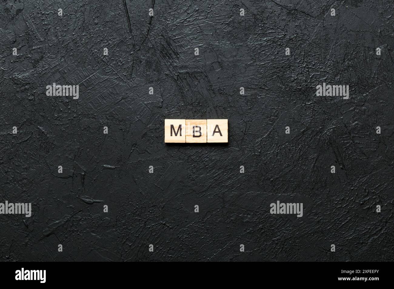 MBA word written on wood block. Master of Business Administration text ...