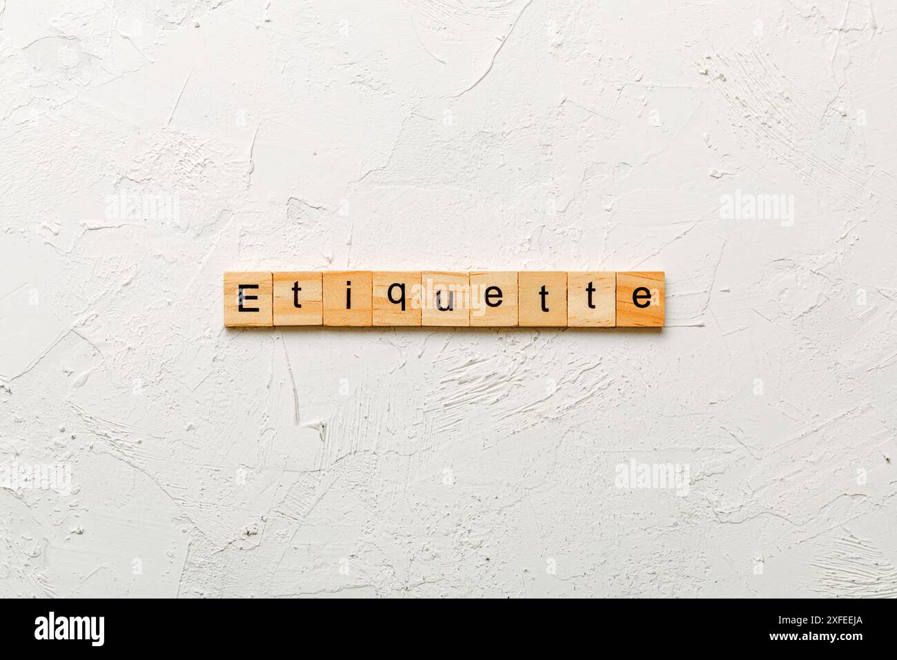 ETIQUETTE word written on wood block. ETIQUETTE text on cement table for your desing, concept ...
