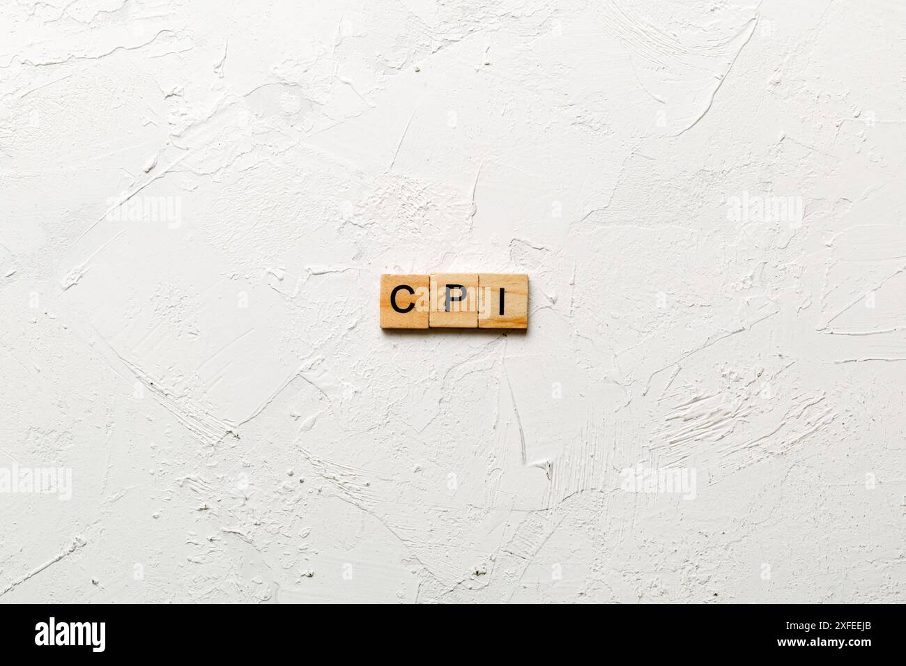 CPI word written on wood block. abbreviation consumer price index text ...