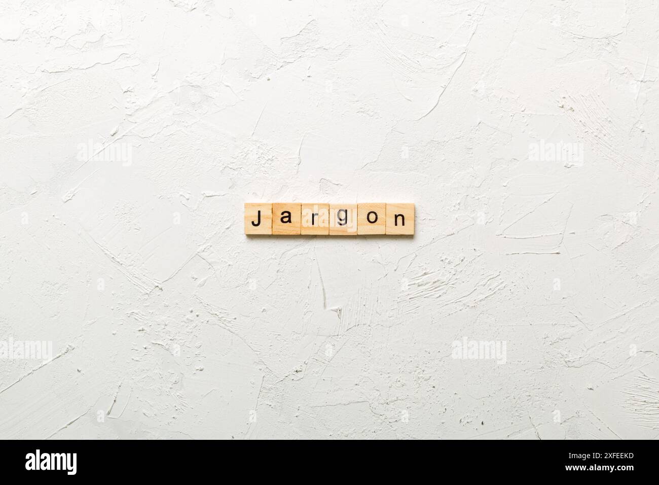 Jargon word written on wood block. Jargon text on cement table for your ...