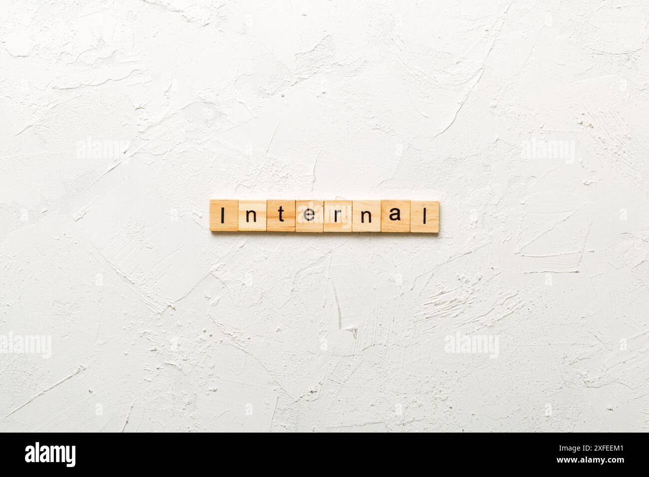 INTERNAL word written on wood block. INTERNAL text on cement table for ...