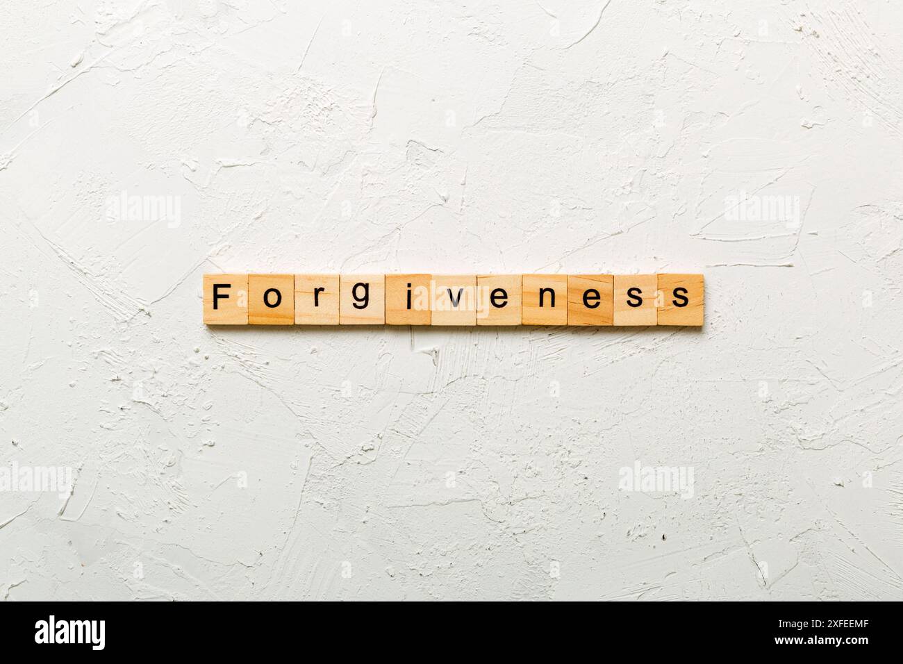 forgiveness word written on wood block. forgiveness text on table ...