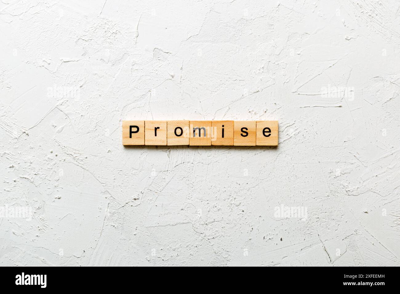Promise word written on wood block. Promise text on cement table for ...