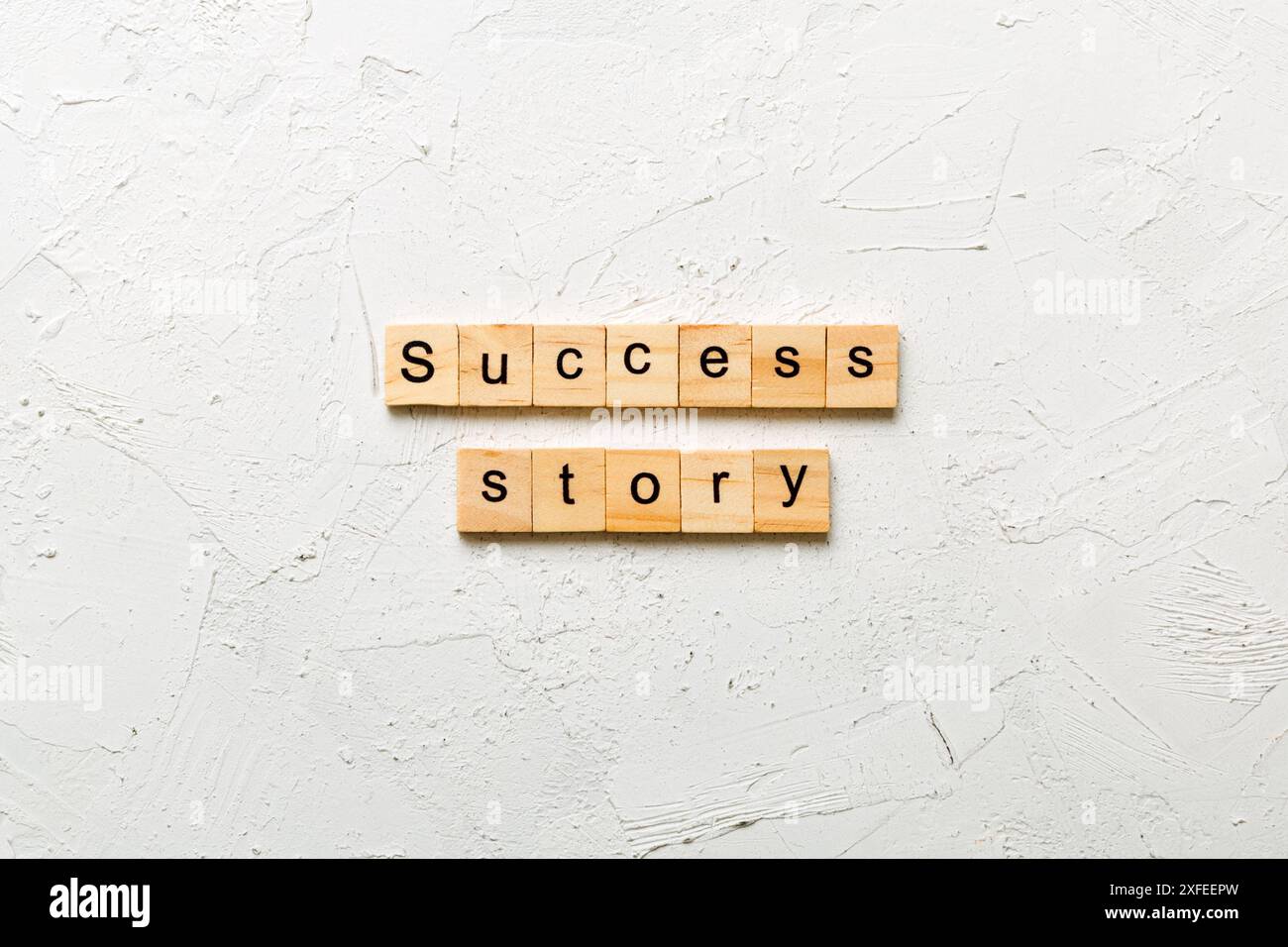 Success story word written on wood block. Success story text on table ...