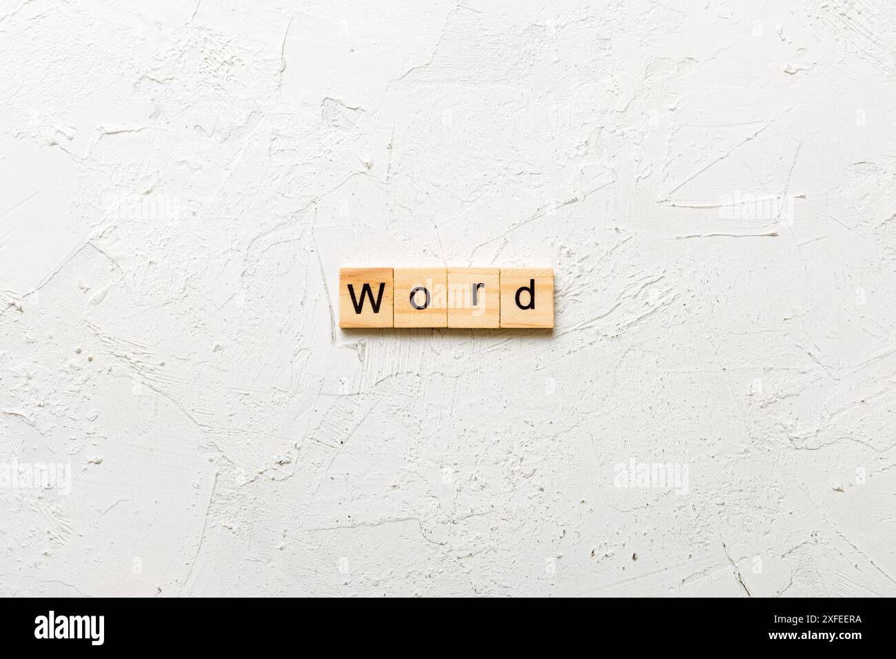 word written on wood block. WORD text on cement table for your desing ...