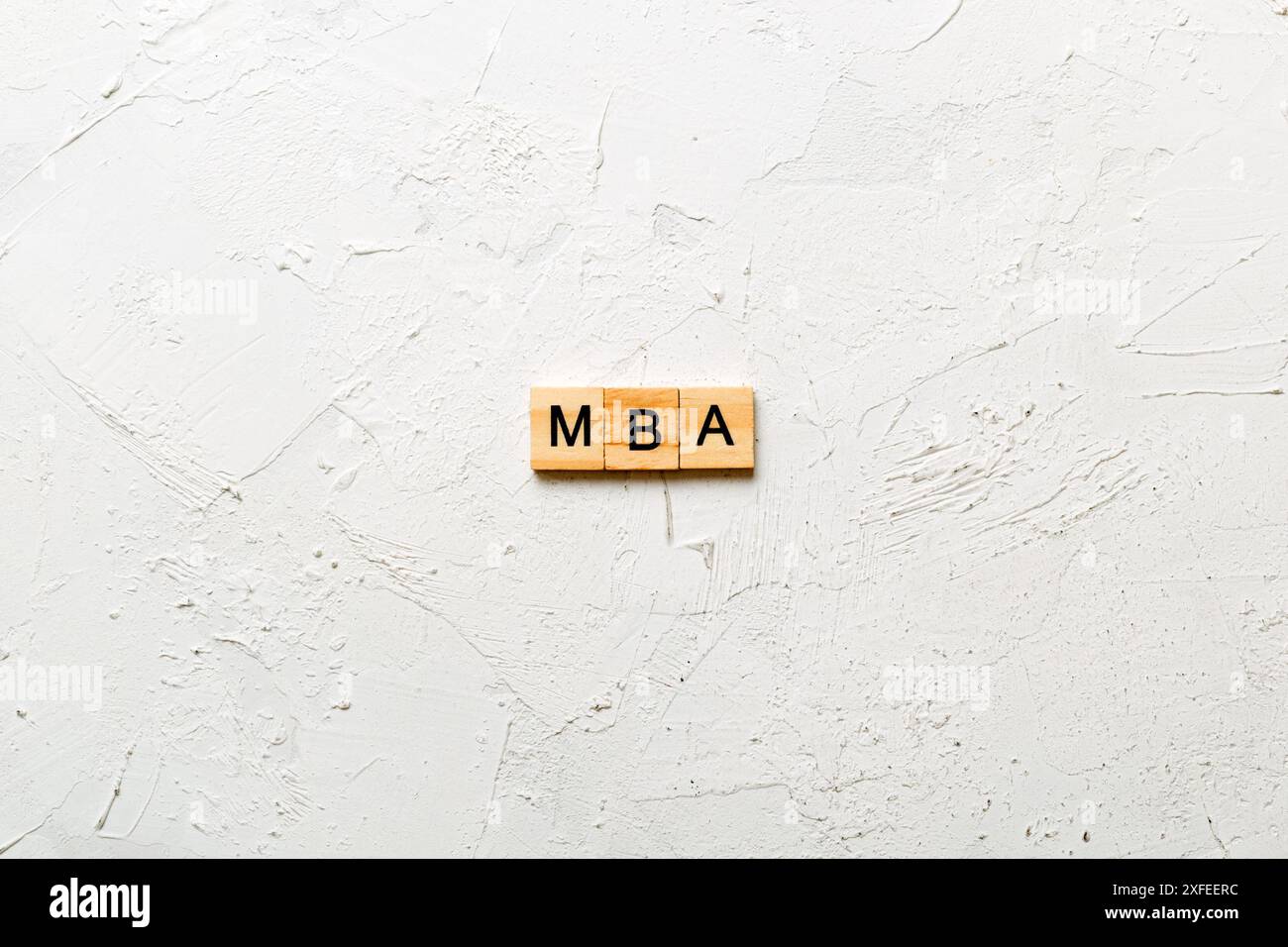 MBA word written on wood block. Master of Business Administration text ...