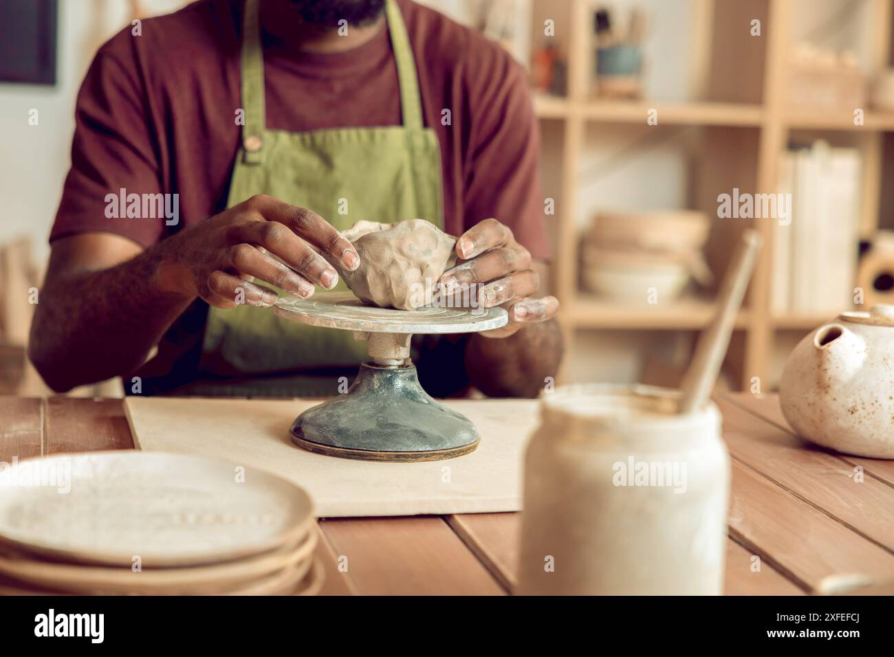 Close up picture of a mans hands molding a shape of the clay mug Stock ...