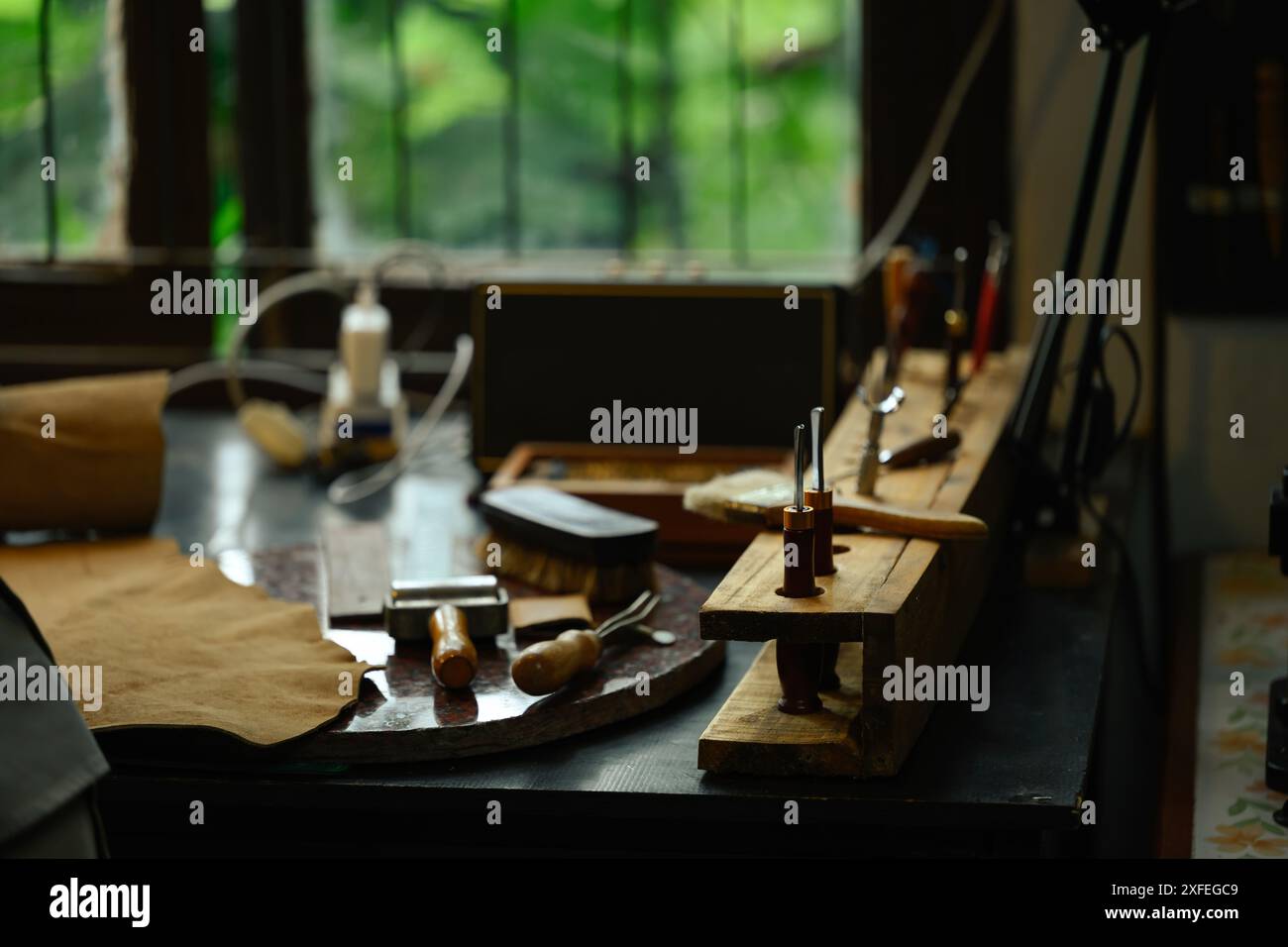 Still life tools for the manufacture of leather products on wooden ...