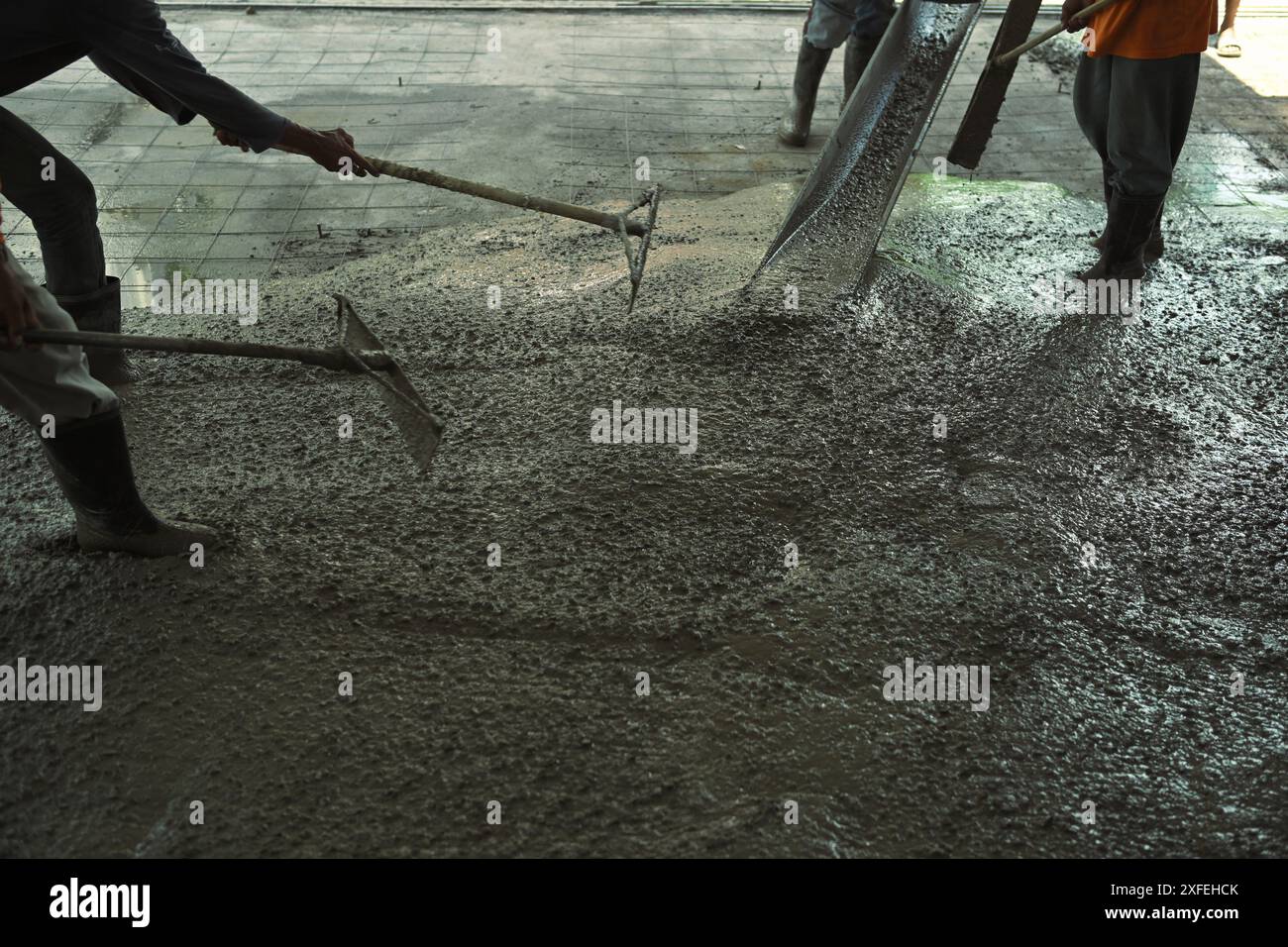 Construction site workers leveling cement hi-res stock photography and ...