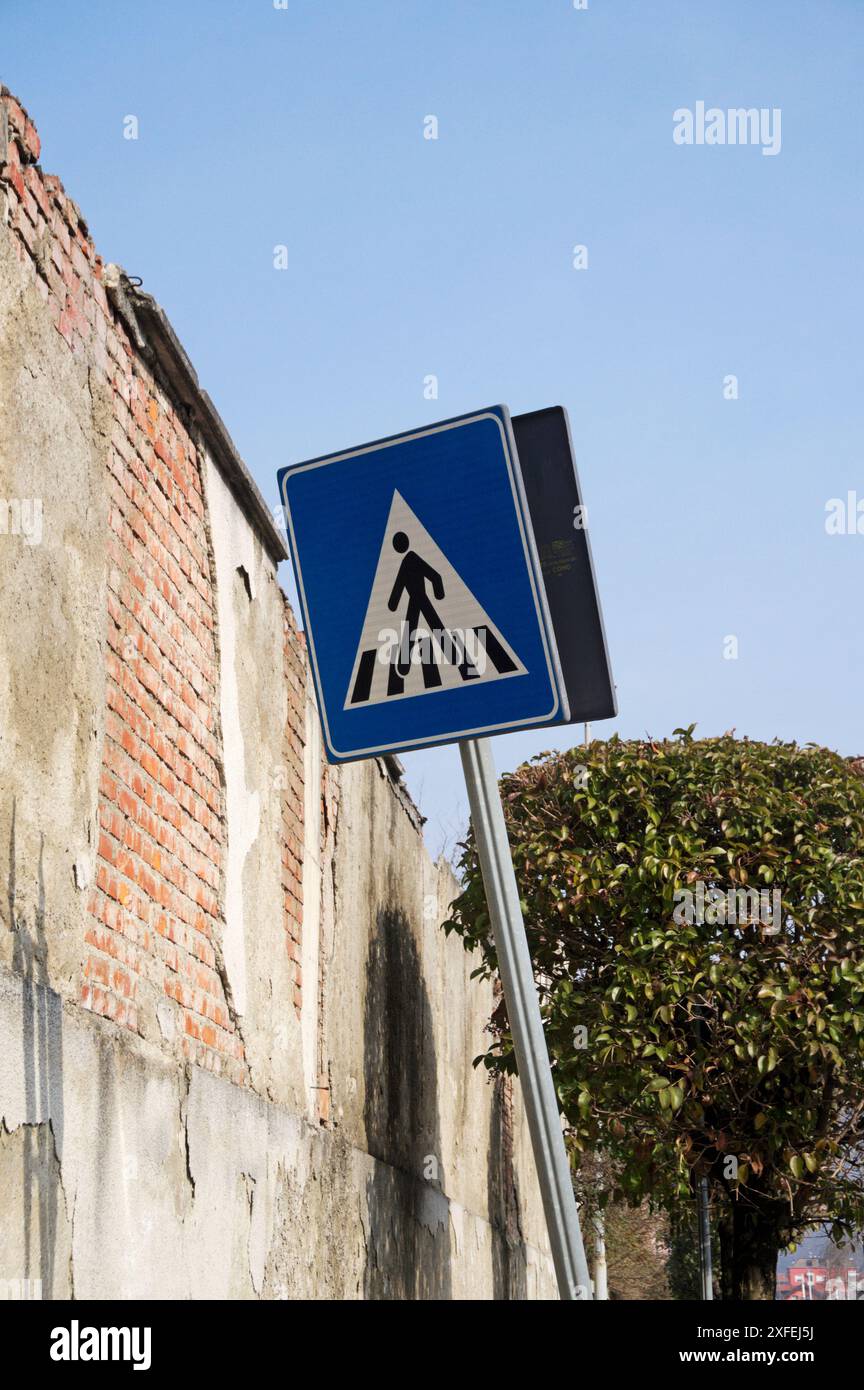 a tilted pedestrian crossing sign Stock Photo - Alamy