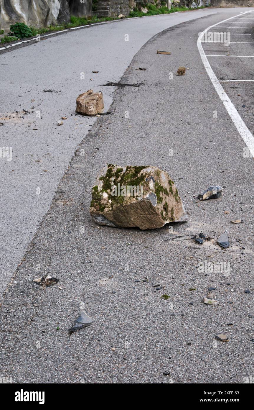 mountain rocks fallen on the road Stock Photo - Alamy