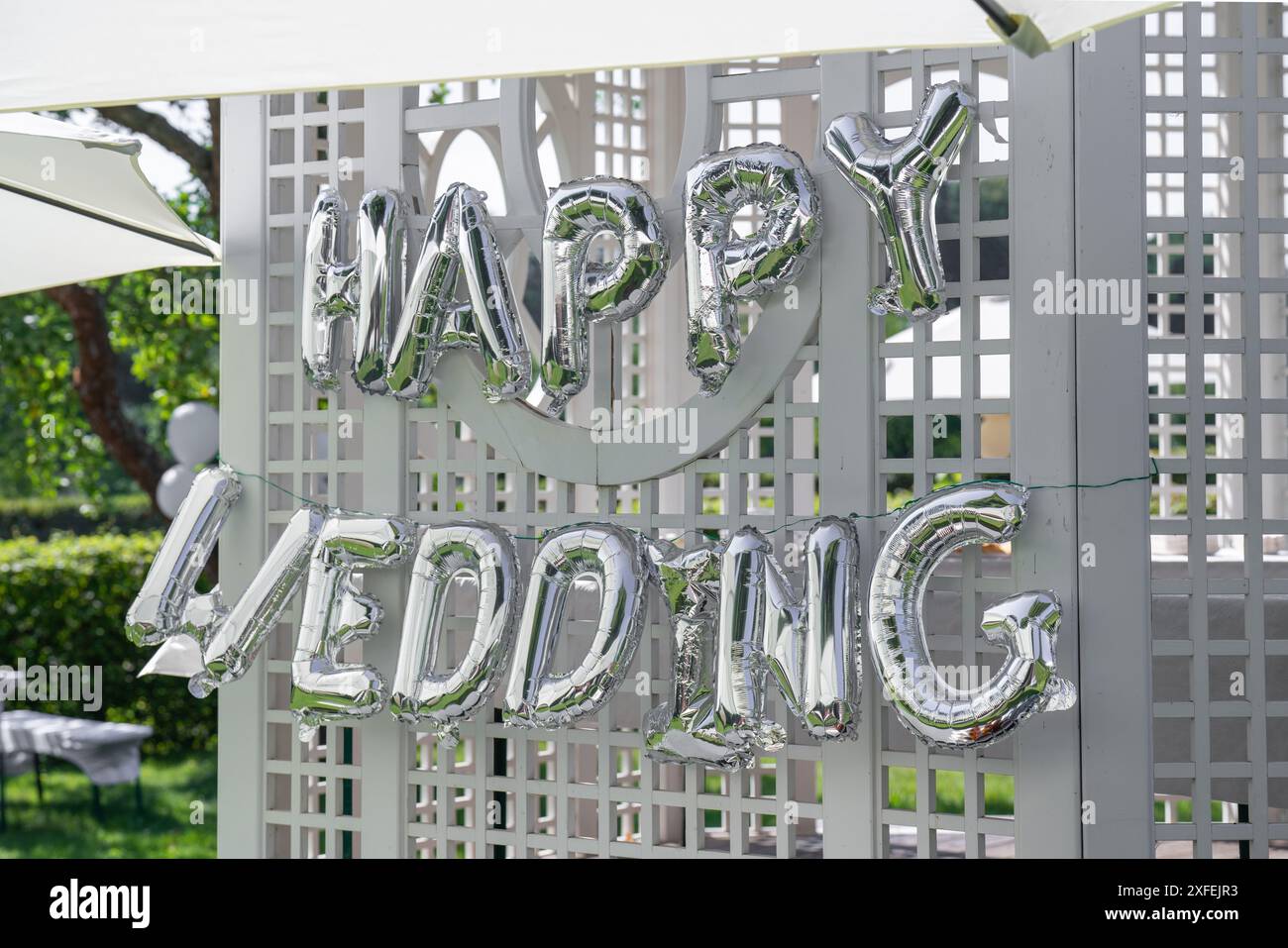 The inscription happy wedding on a white wooden fence Stock Photo - Alamy