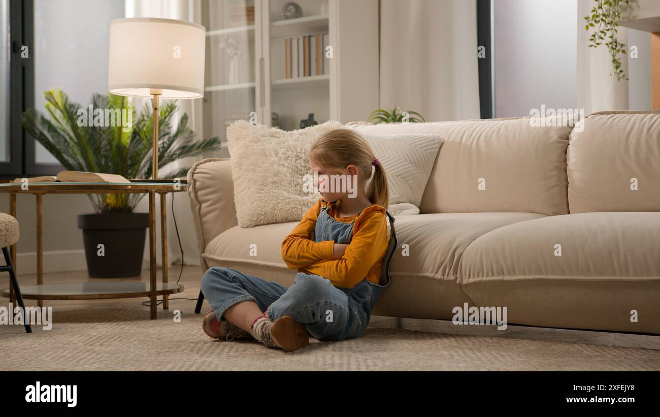Offended angry little Caucasian child girl feeling lonely stressed ...