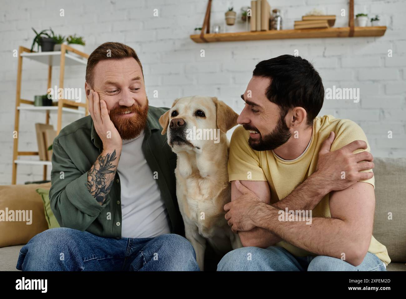 A bearded man and his partner enjoy a quiet moment sitting on a couch ...