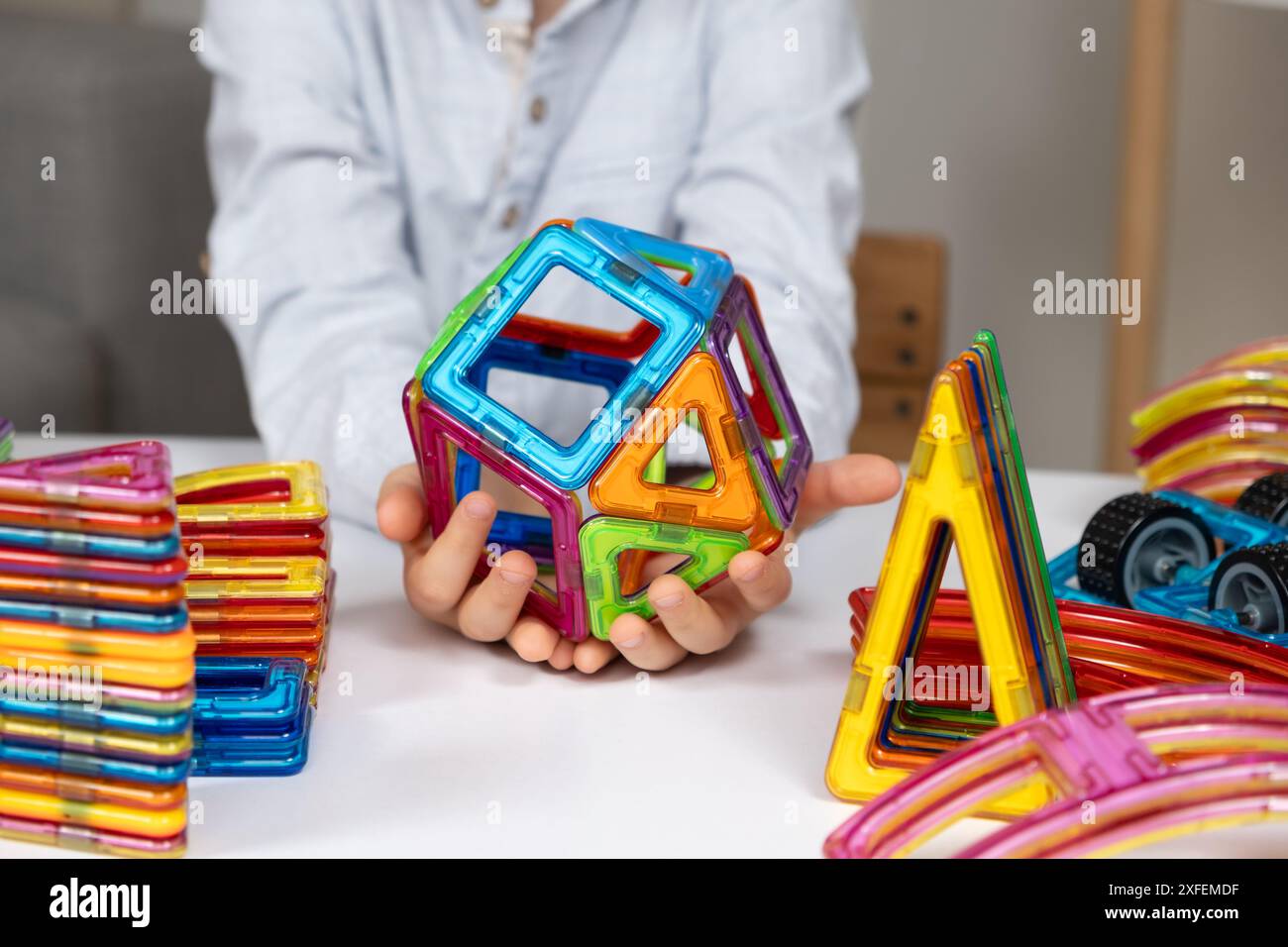 Child playing magnetic constructor hands hi-res stock photography and ...