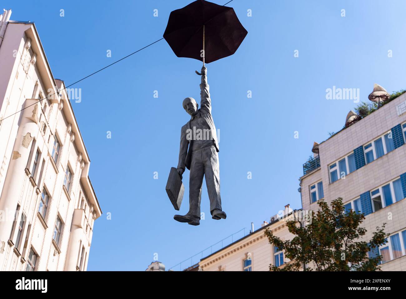 Prague, Czech Republic - September 17, 2023. Statue of man hanging with ...