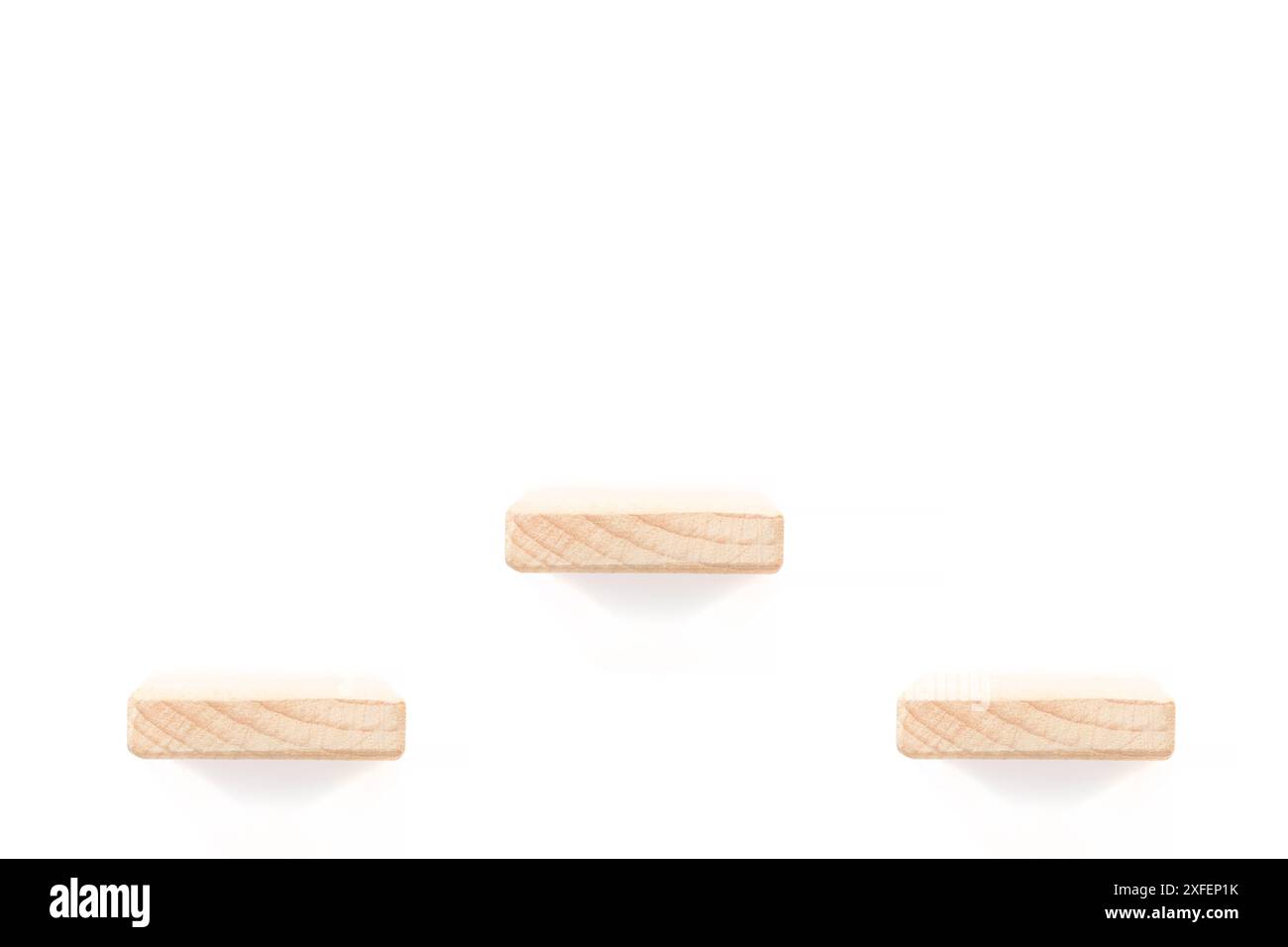 showcase for three items: three wooden shelves over white background ...