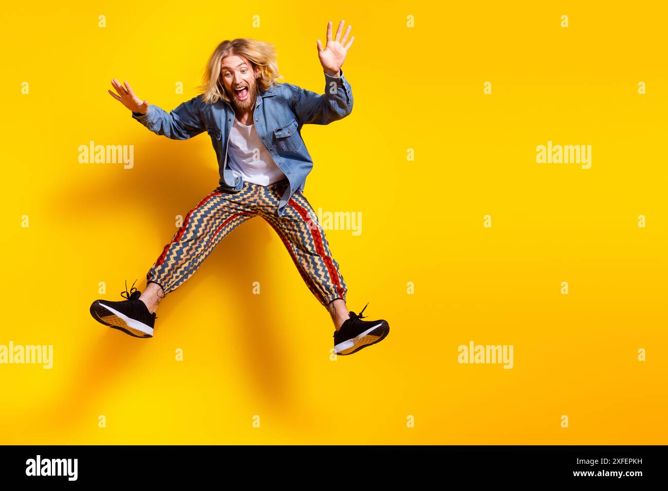 Full body photo of attractive young man falling down scared dressed ...