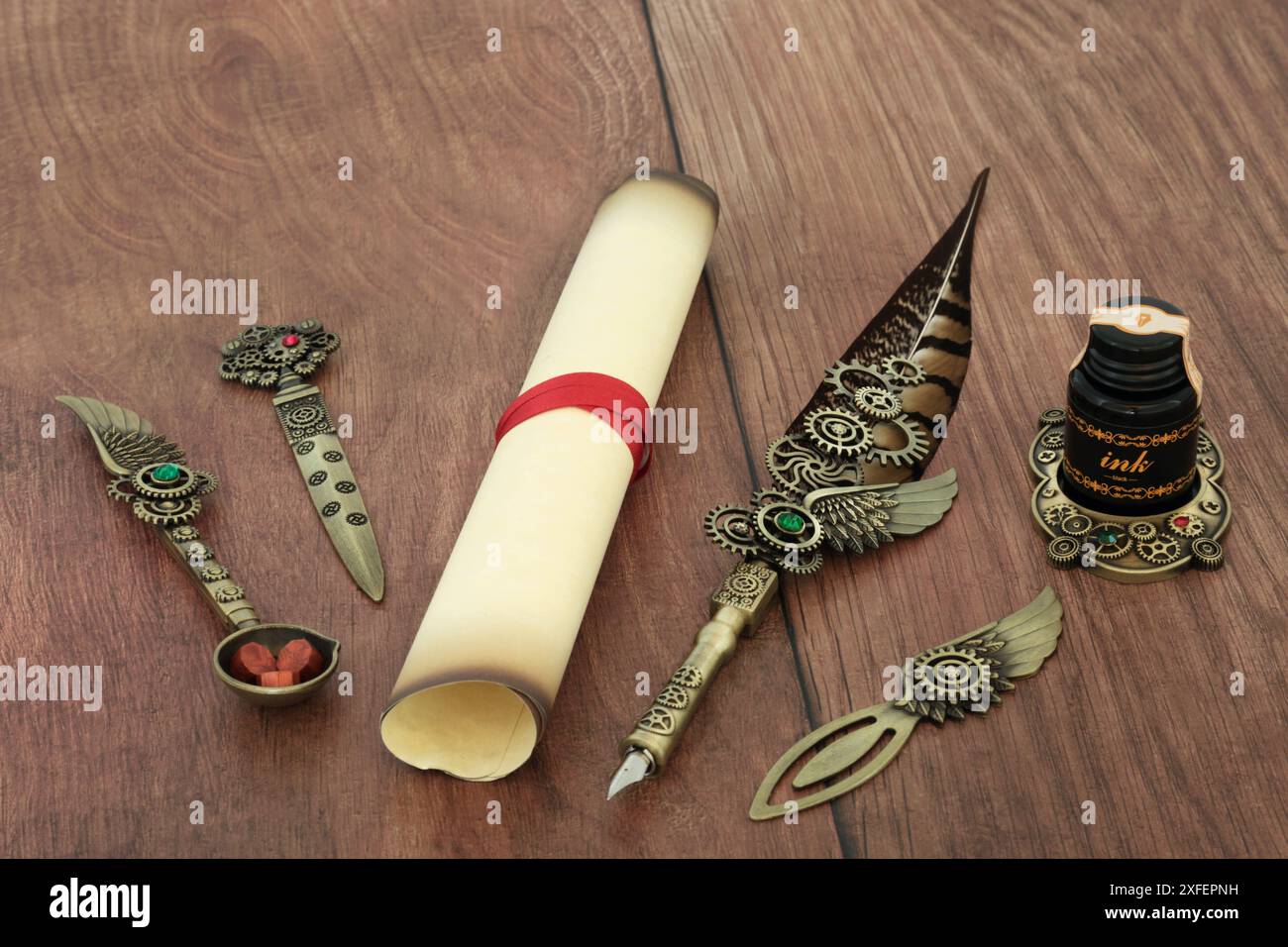 Parchment faded paper scroll with feather quill nib pen and old brass ...