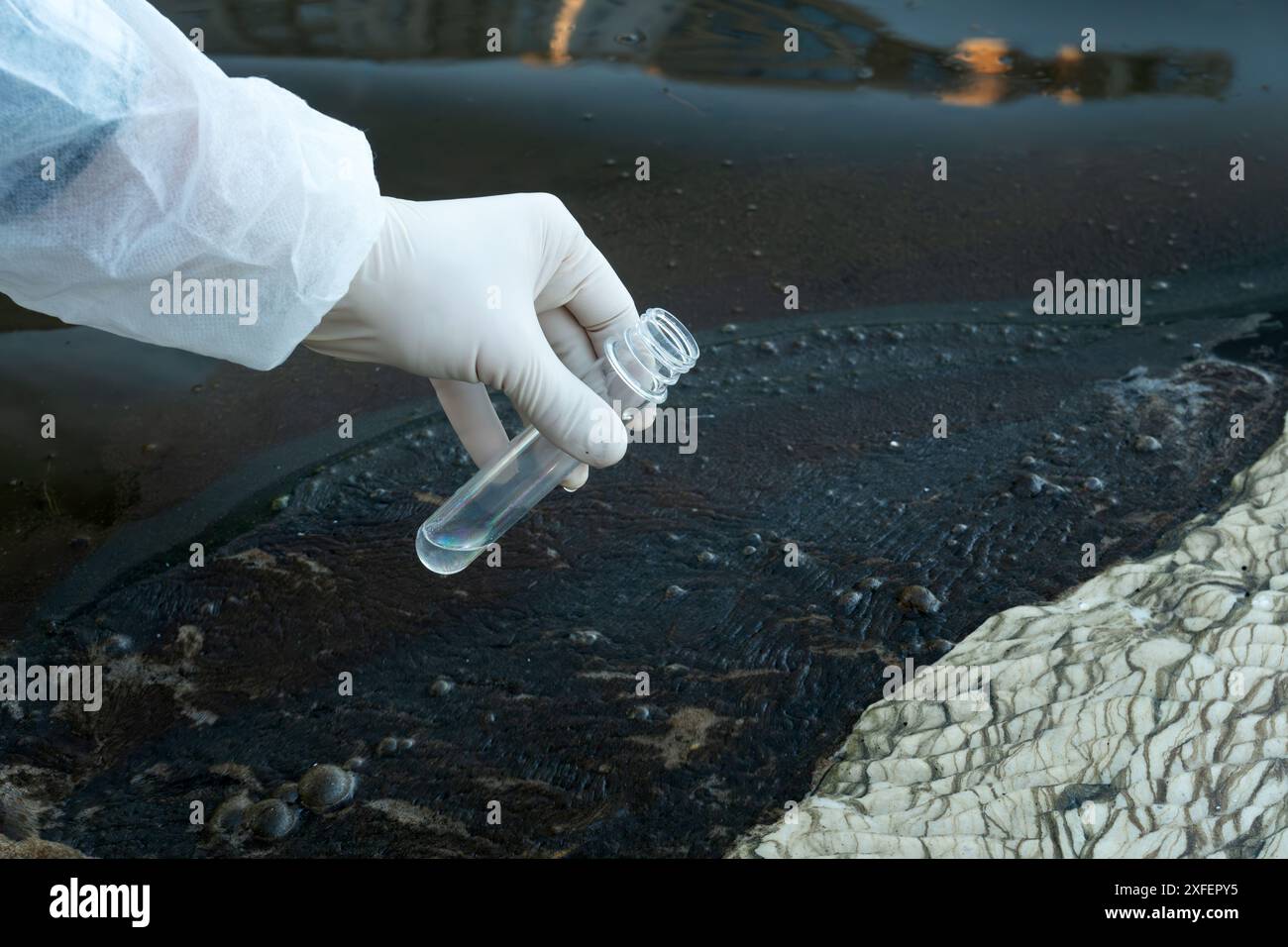 Water pollution examine concept. Scientists with protective suit ...