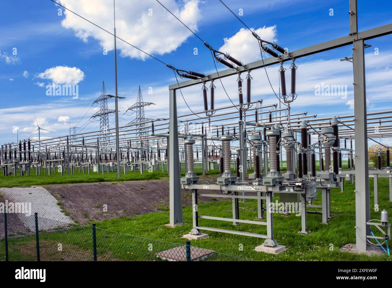 Power pylons with high-voltage lines and insulators at the Avacon ...