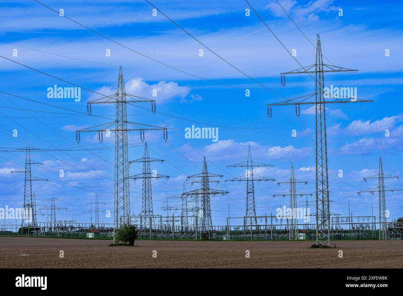 Electricity pylon with high-voltage lines at the Avacon substation in ...