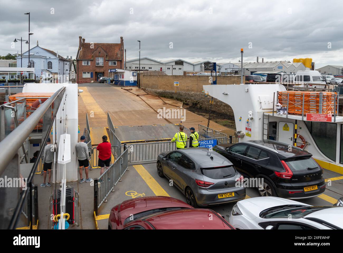 Cowes floating bridge approaching West Cowes with cars and foot ...