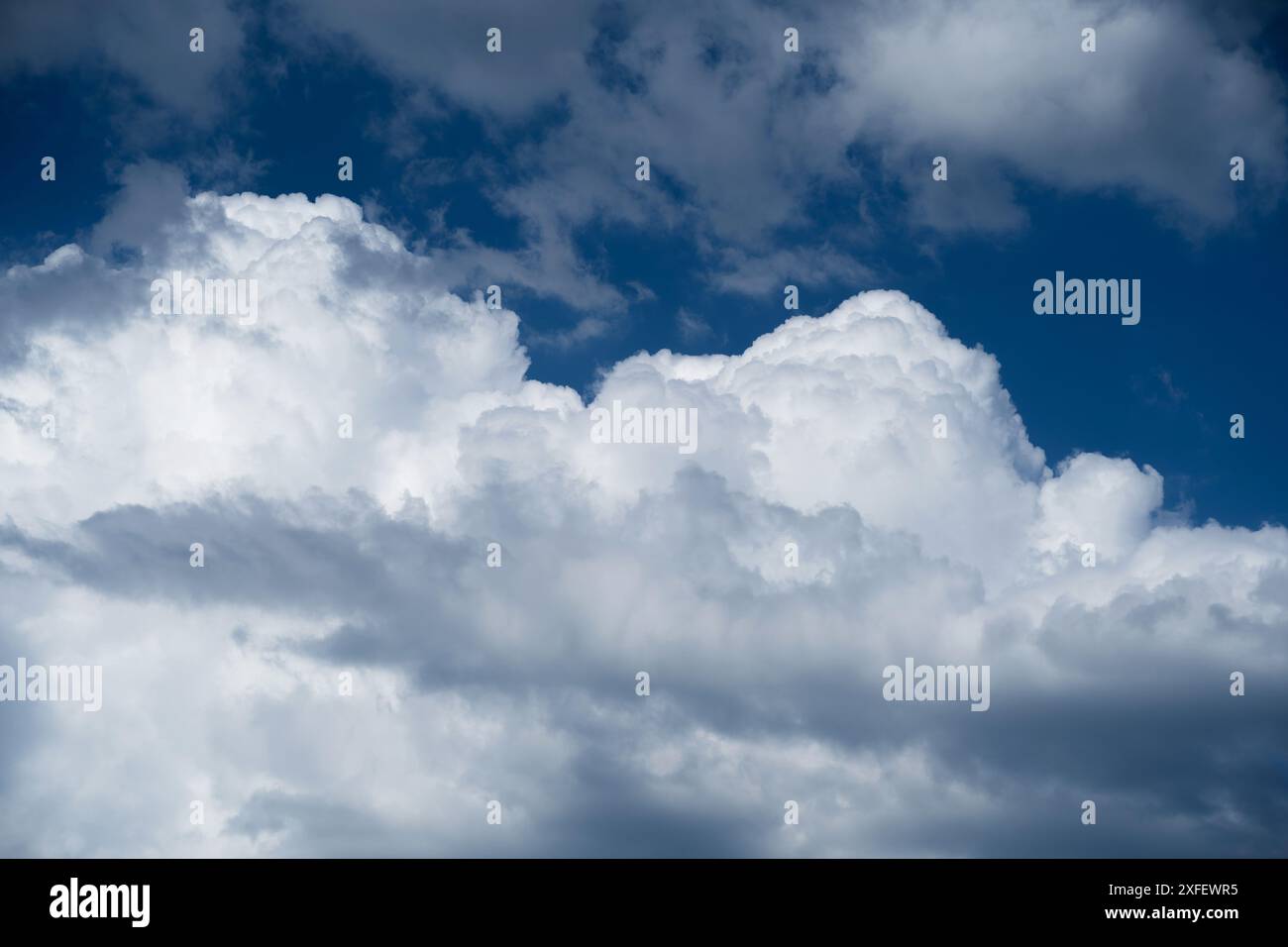 Snow-white cumulus clouds in the blue sky Stock Photo - Alamy