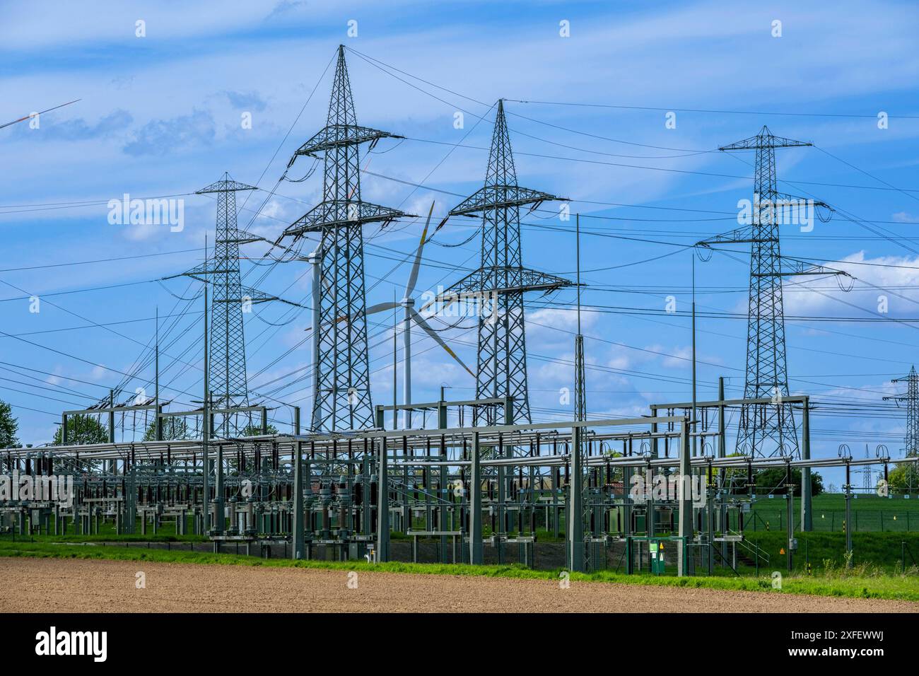 Electricity pylon with high-voltage lines at the Avacon substation in ...