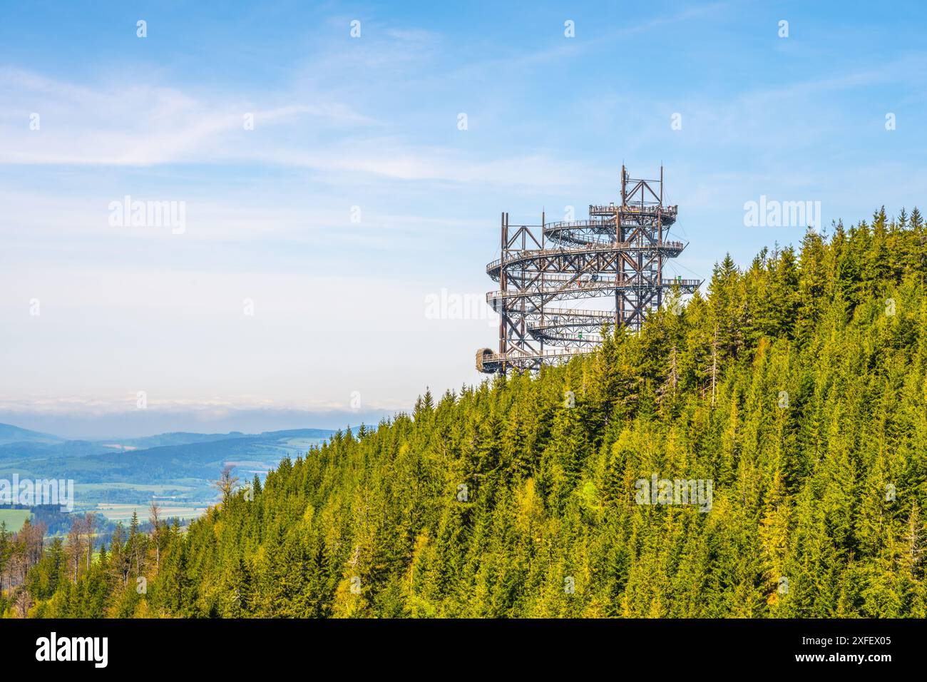 Sky Walk tower in Dolni Morava Resort, surrounded by trees and blue sky ...