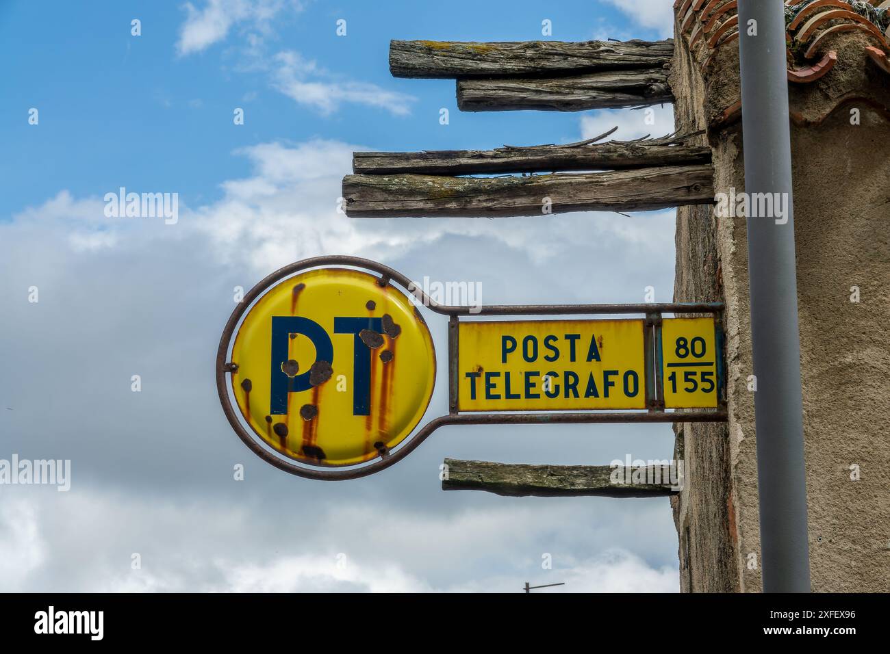 Ancient and rusty Posta Telegrafo (post and telegraph) yellow italian ...