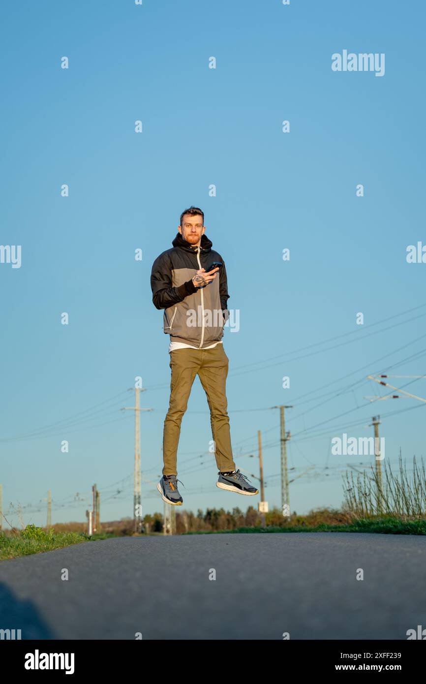 Man performing aerial skateboard trick mid-air Stock Photo - Alamy