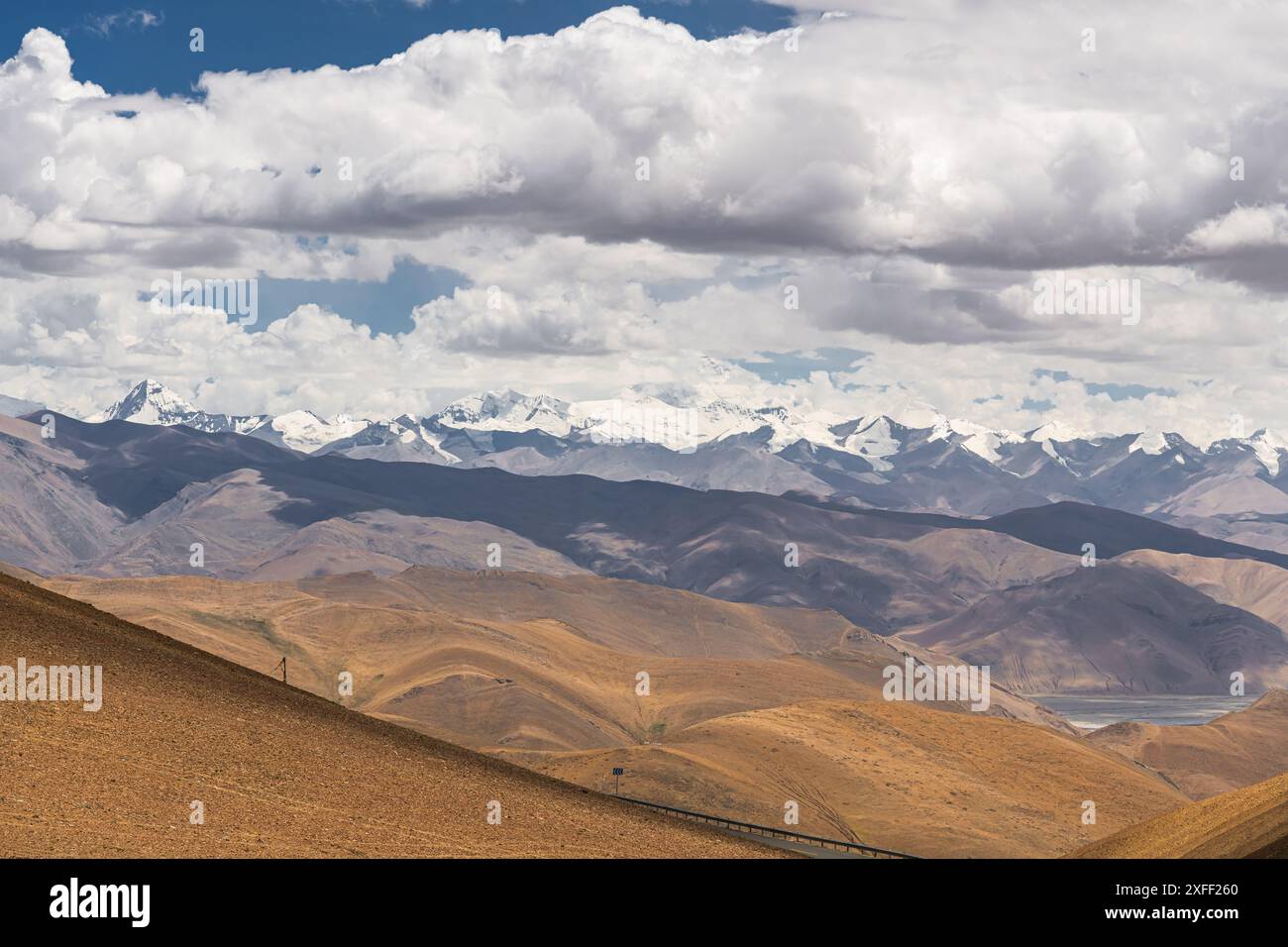 FRIENDSHIP HIGHWAY, TIBET, CHINA: dry yellow winter landscape and snowy ...