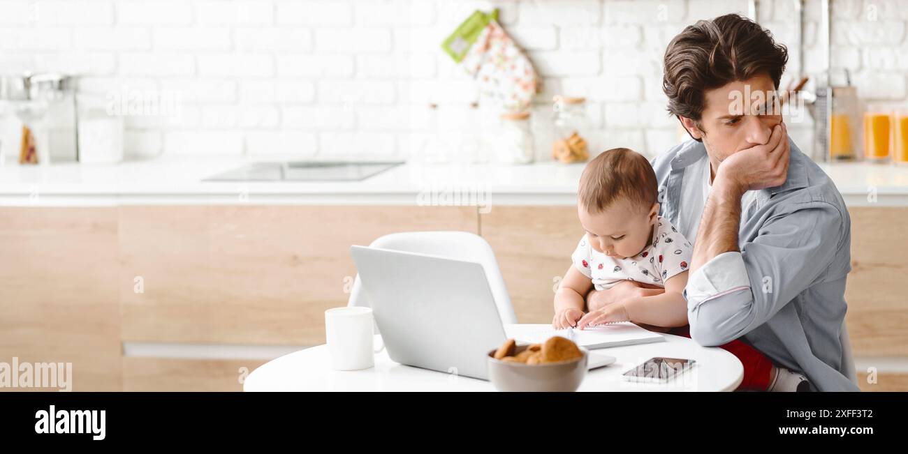Tired Father Working From Home While Holding Infant Son Stock Photo - Alamy
