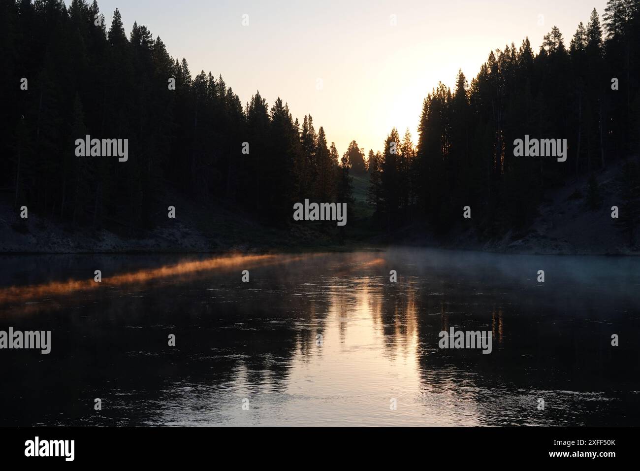 Orange Ray of Light Across Yellowstone River Stock Photo - Alamy