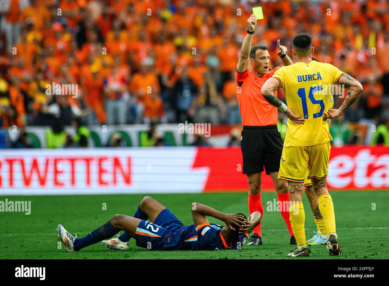 MUENCHEN, GERMANY - 2 JULY, 2024: Denzel Dumfries, Felix Zwayer, Andrei ...