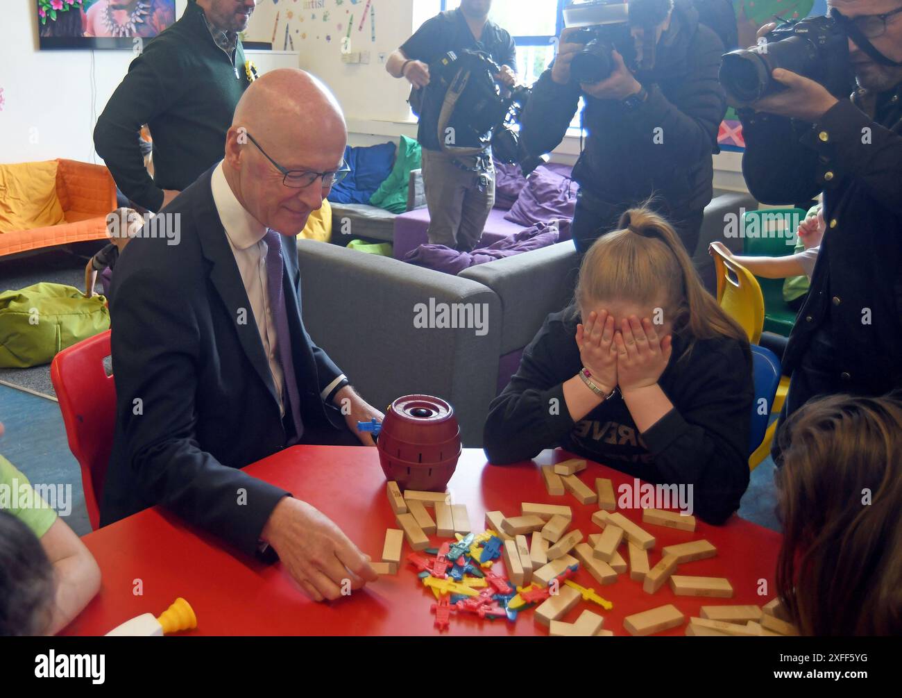 Scottish First Minister and SNP leader John Swinney plays with Jenga ...
