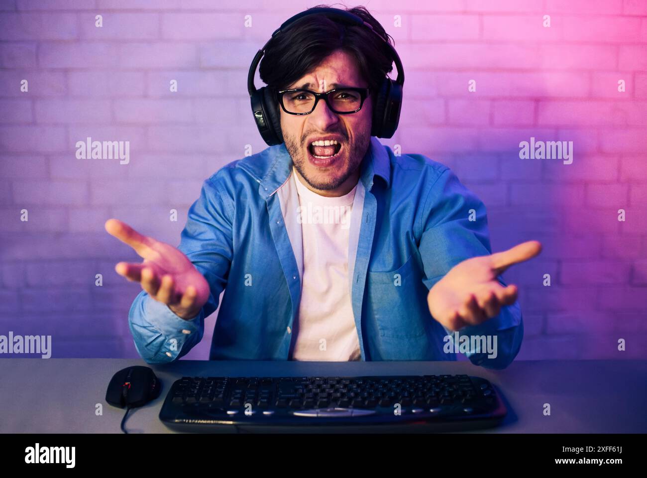 Frustrated Gamer Reacting to Game Play in Front of Computer Stock Photo ...