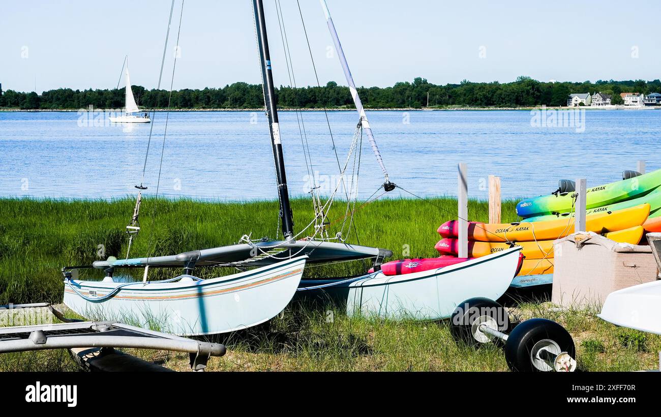 NORWALK, CT, USA - JULY 2, 2024: Two white and blue Hobie Cat sailboats ...