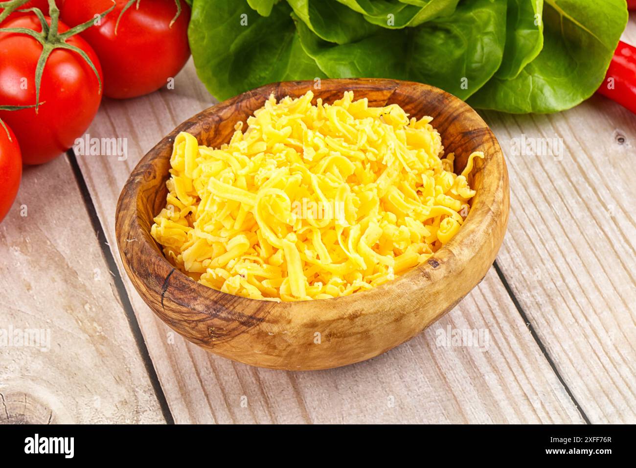 Shredded yellow cheese in the bowl Stock Photo - Alamy