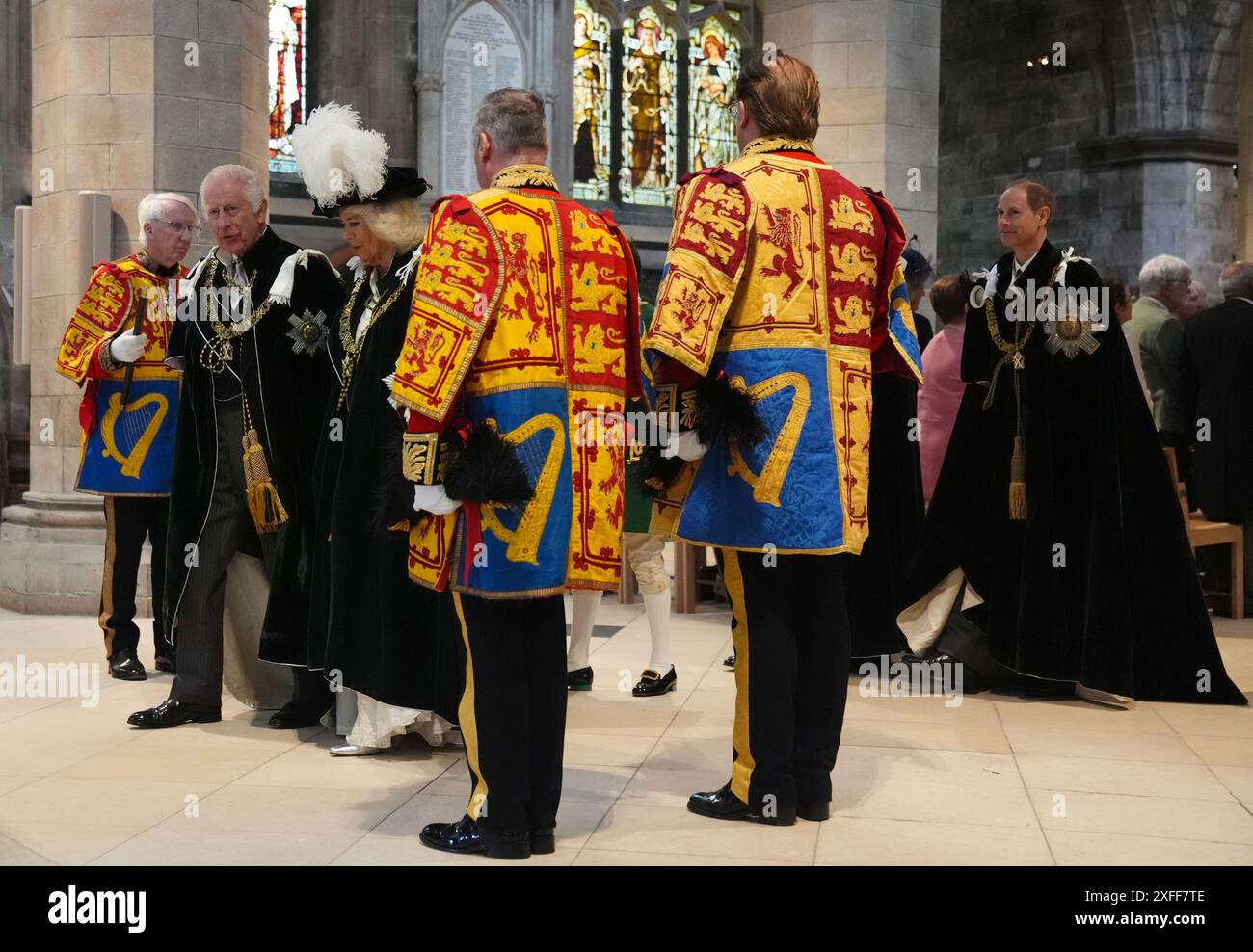 King Charles III and Queen Camilla (centre left) with the Duke of ...