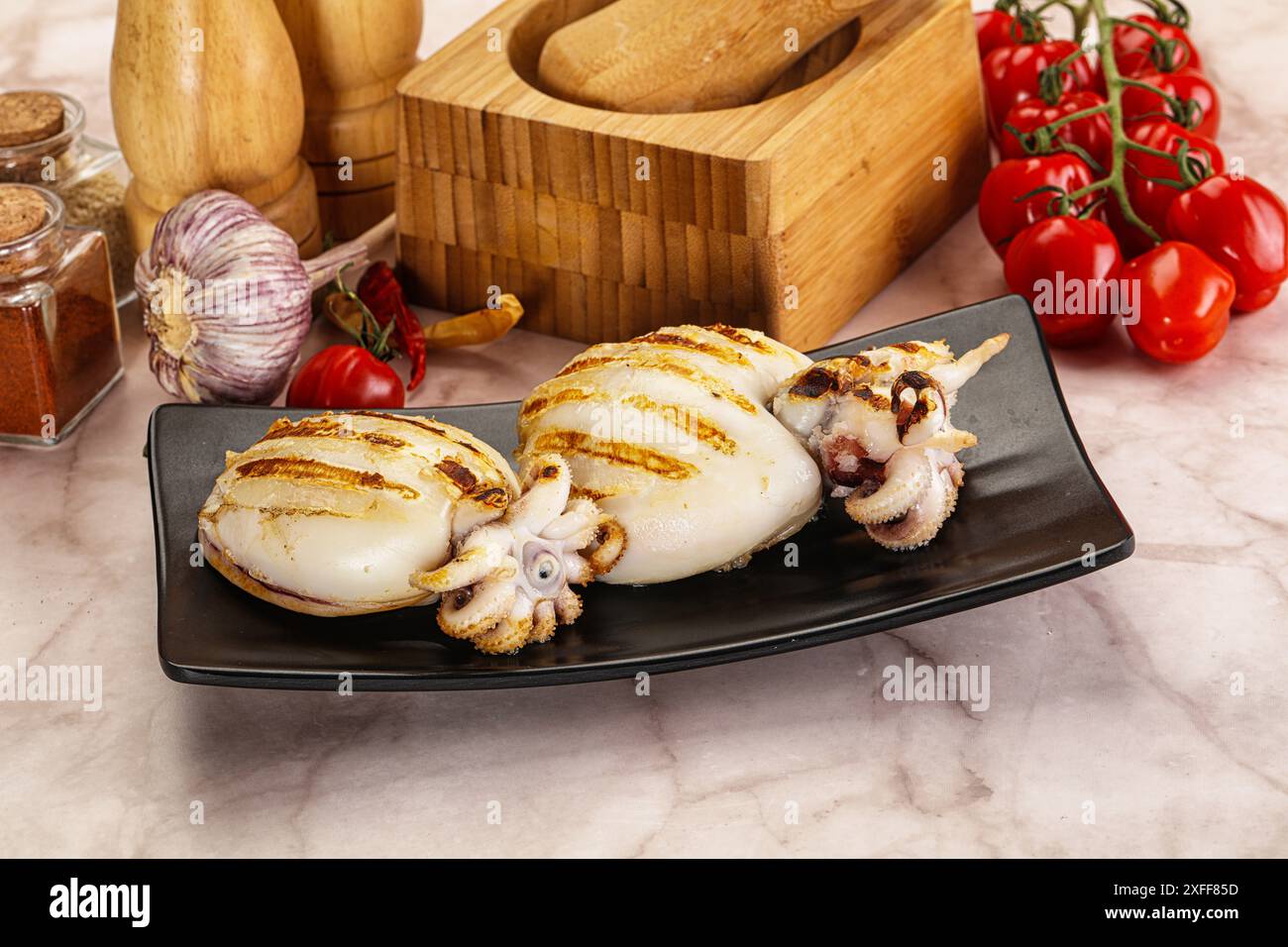 Grilled gourmet cuttlefish in the plate Stock Photo - Alamy