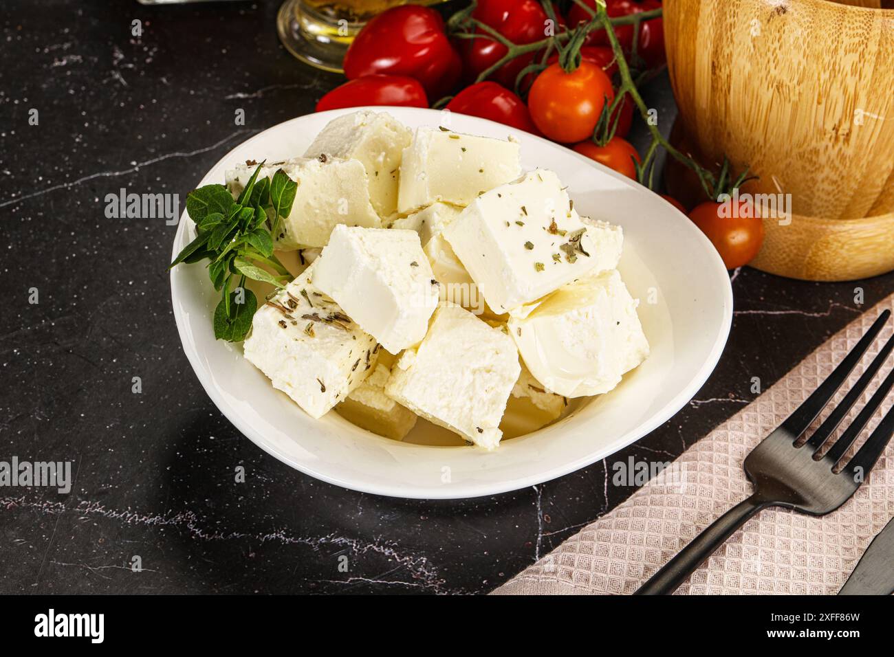 Greek traditional Feta cheese cubes with herbs and spices Stock Photo ...
