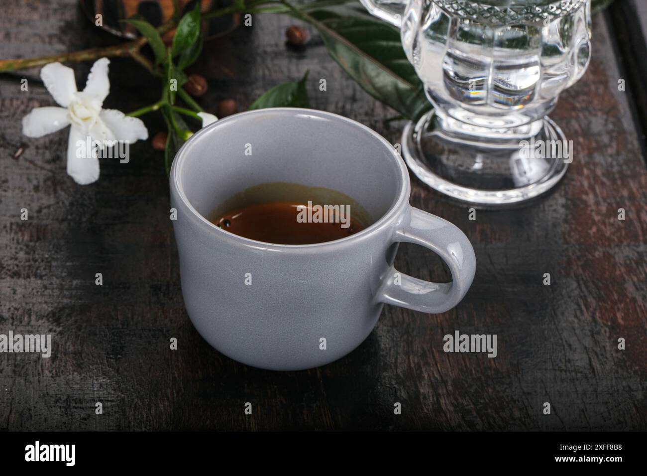 Strong Espresso coffee with cold water Stock Photo - Alamy
