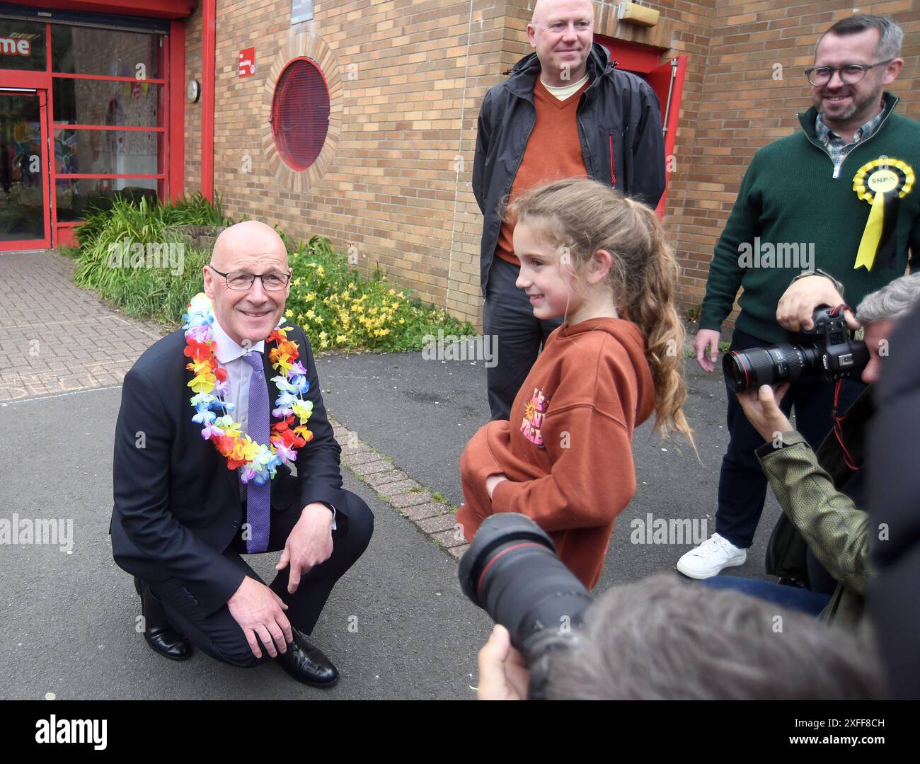 Scottish First Minister and SNP leader John Swinney (left) after being ...