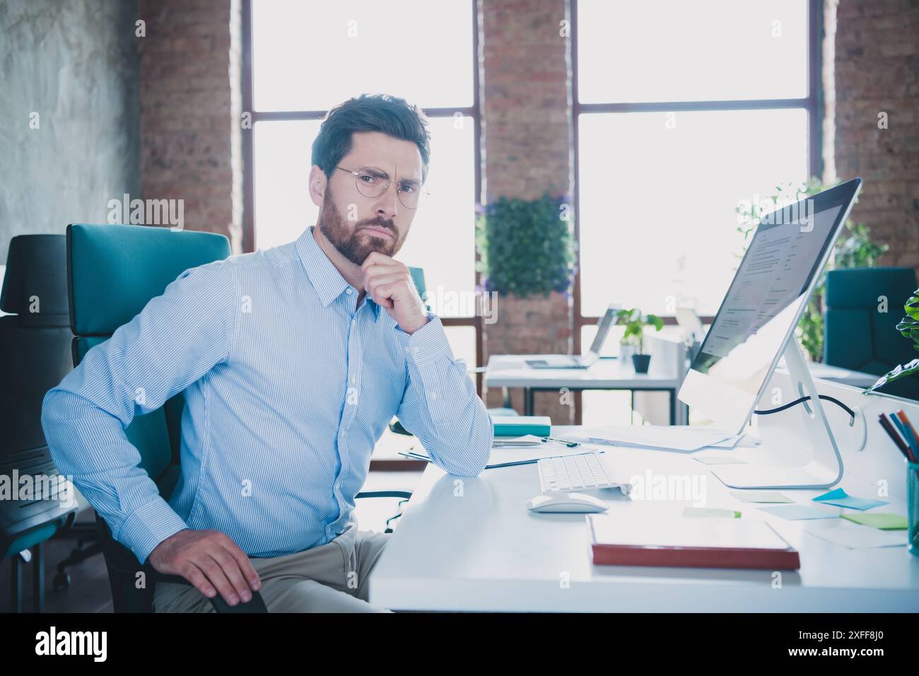 Photo of successful elegant man sit chair contemplate wear shirt loft ...