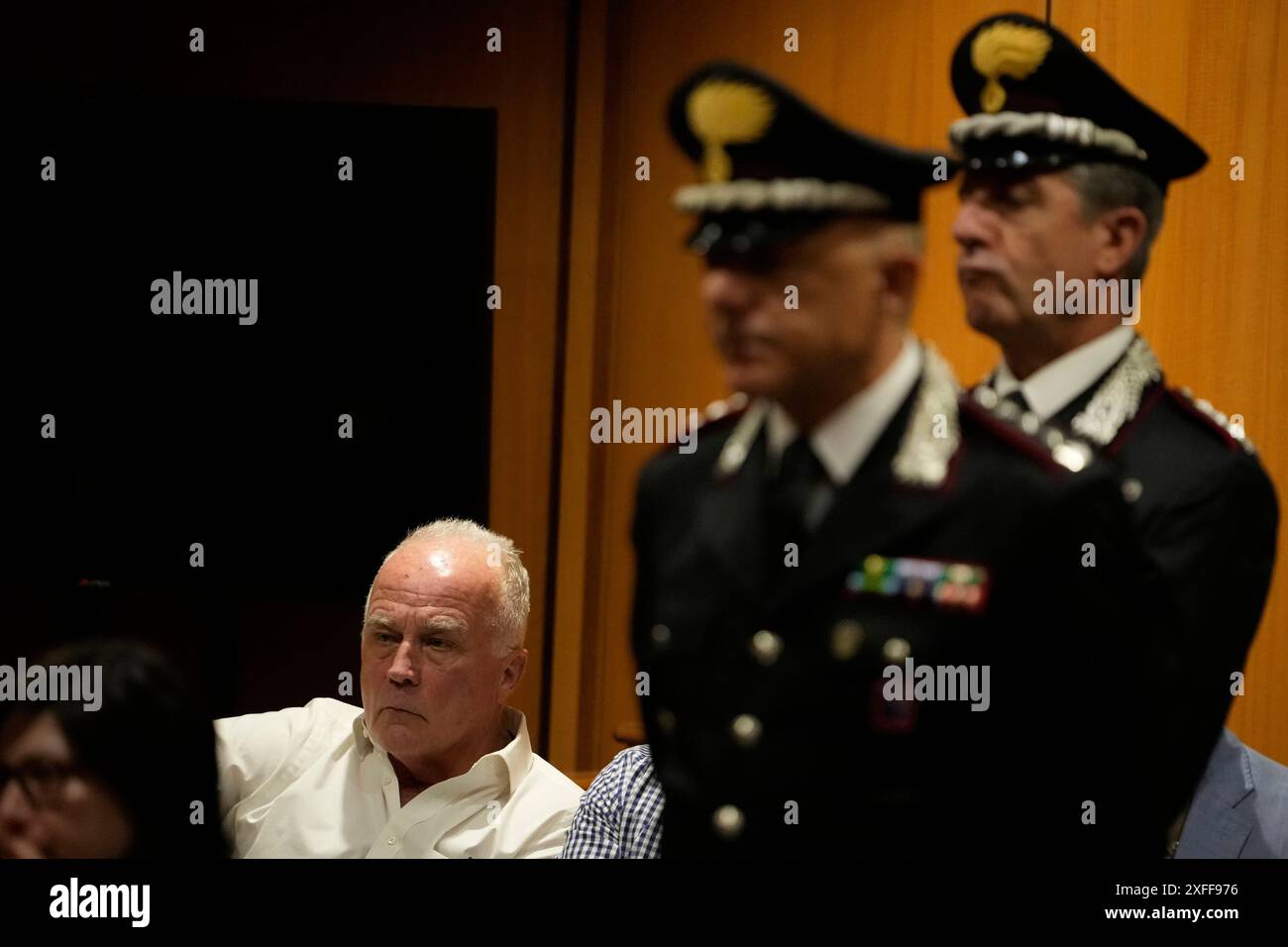 Ethan Elder, father of Finnegan Lee Elder, left, attends a hearing for ...