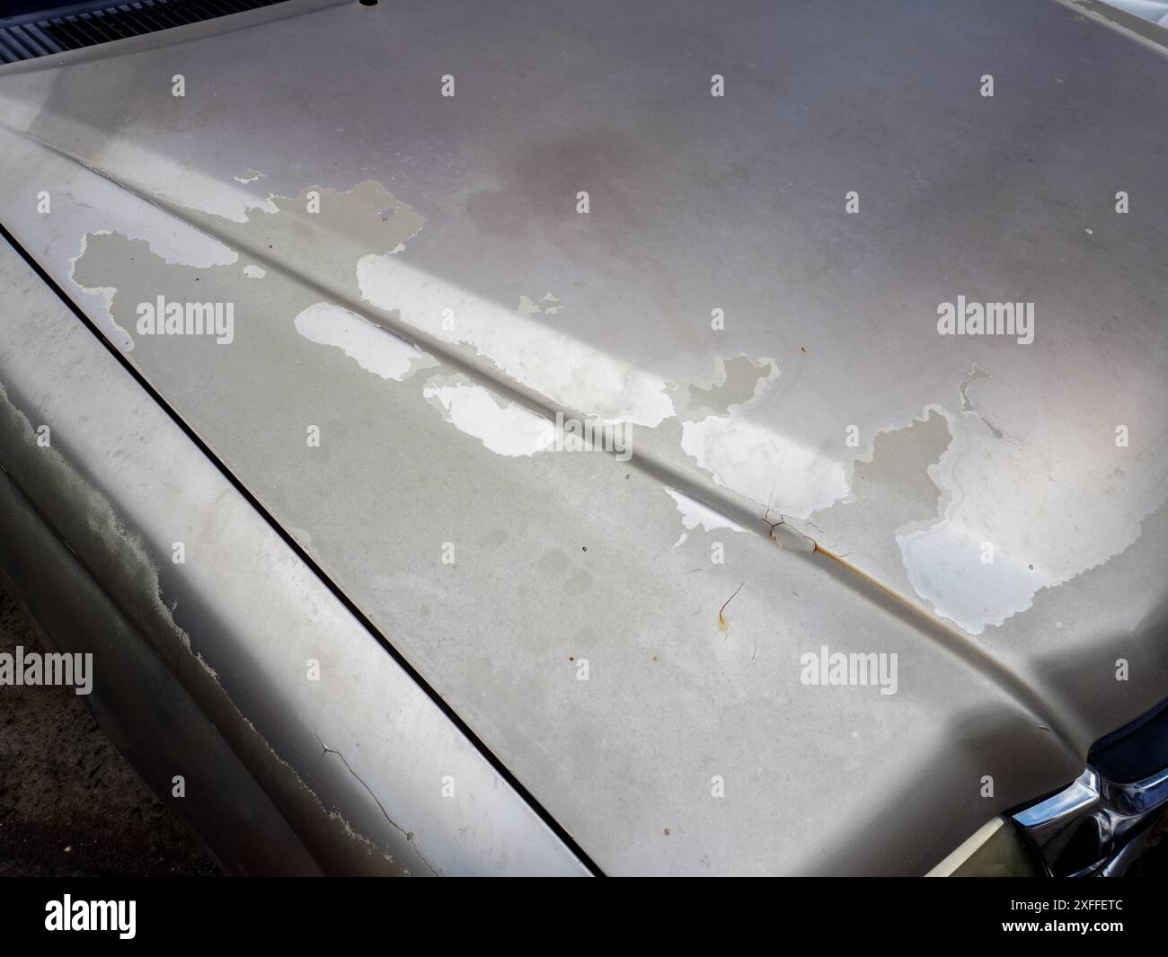Rust and paint damage on part of the old car body. Peeling off old ...