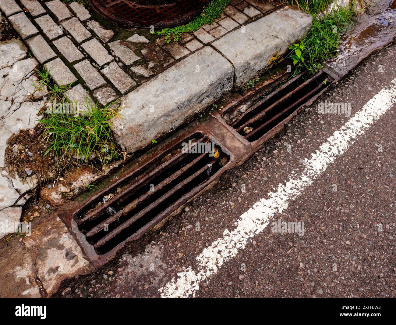 Roadside drainage pipe steel grating Stock Photo - Alamy